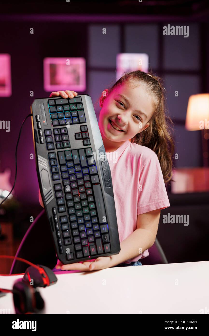 Happy gen Z content creator filming keyboard review in home studio ...