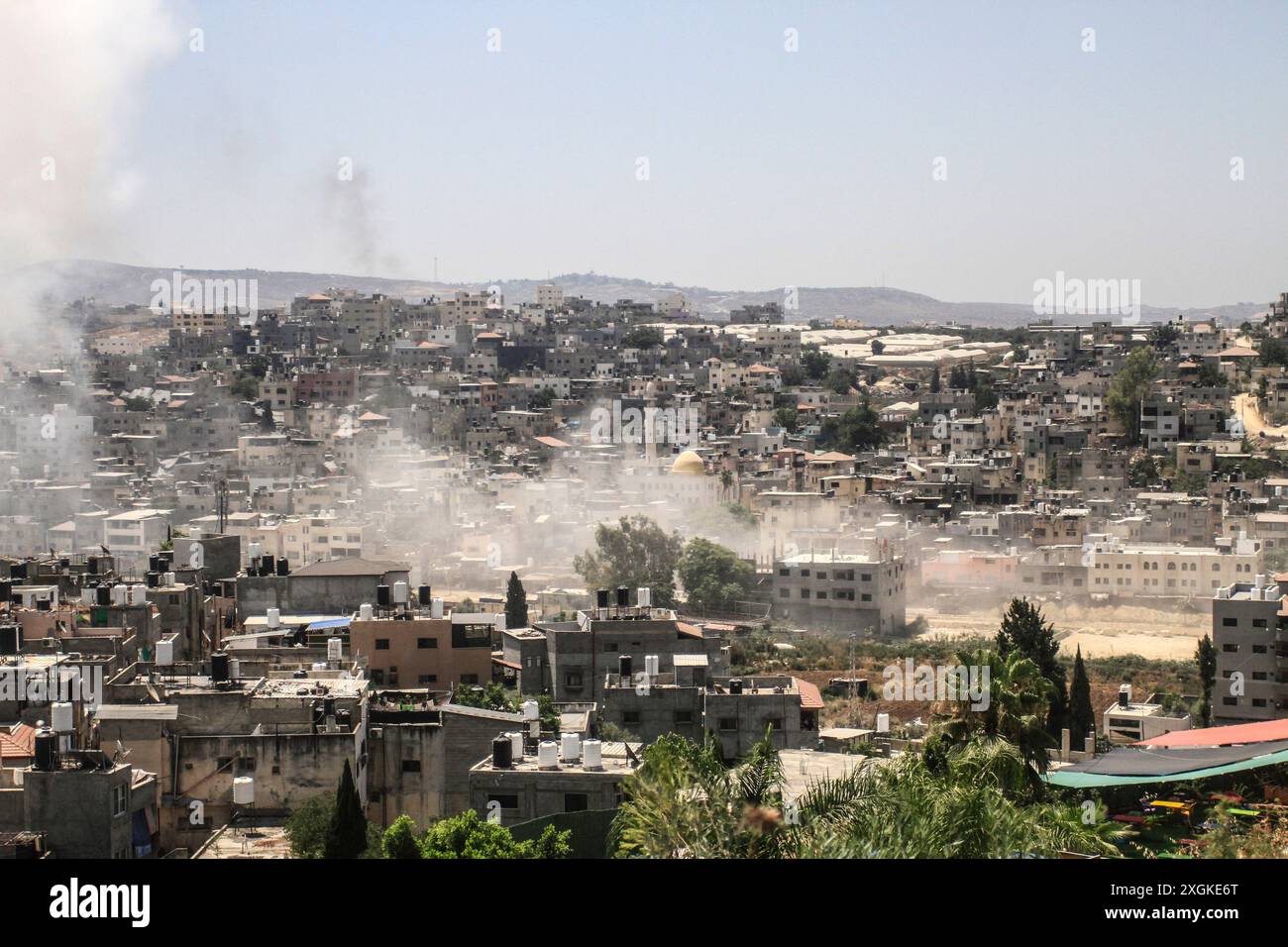 Tulkarm, Palestine. 09th July, 2024. Smoke billows during an Israeli ...