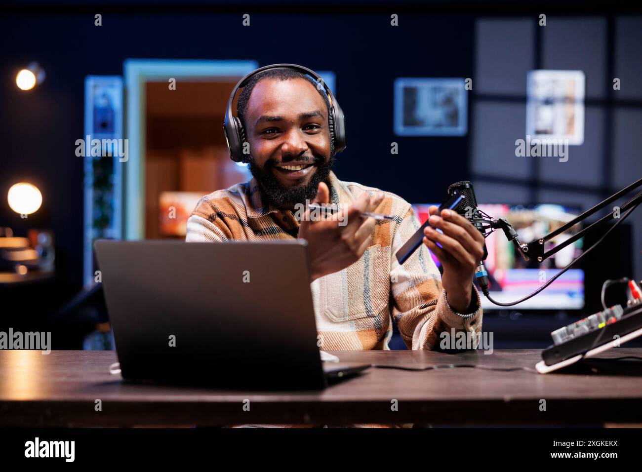 Cheerful tech expert going on-air, describing details of new mobile ...