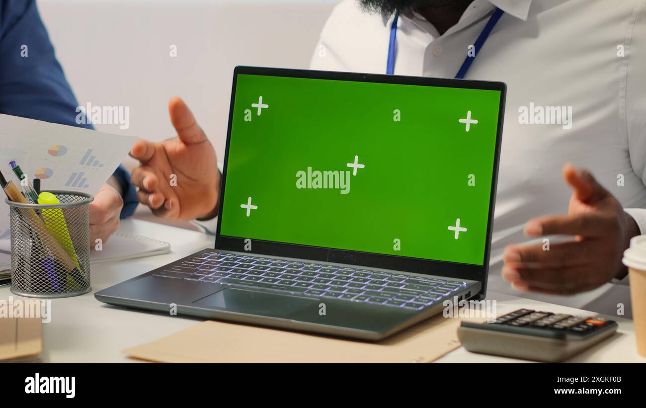 Banker offering pension plans options to elderly people next to ...