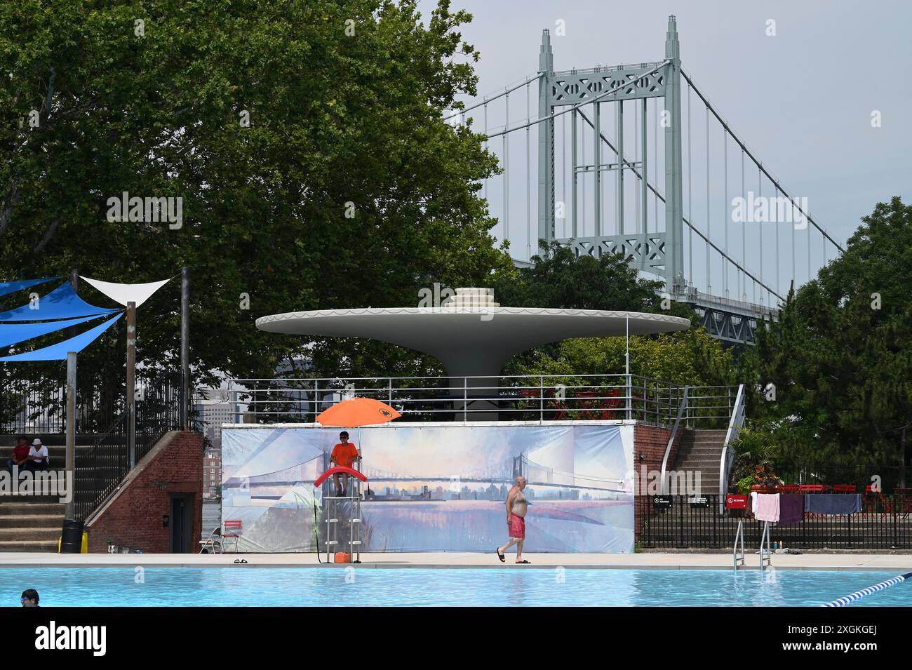 New York, USA. 09th July, 2024. A lifeguard watches as people swim in ...