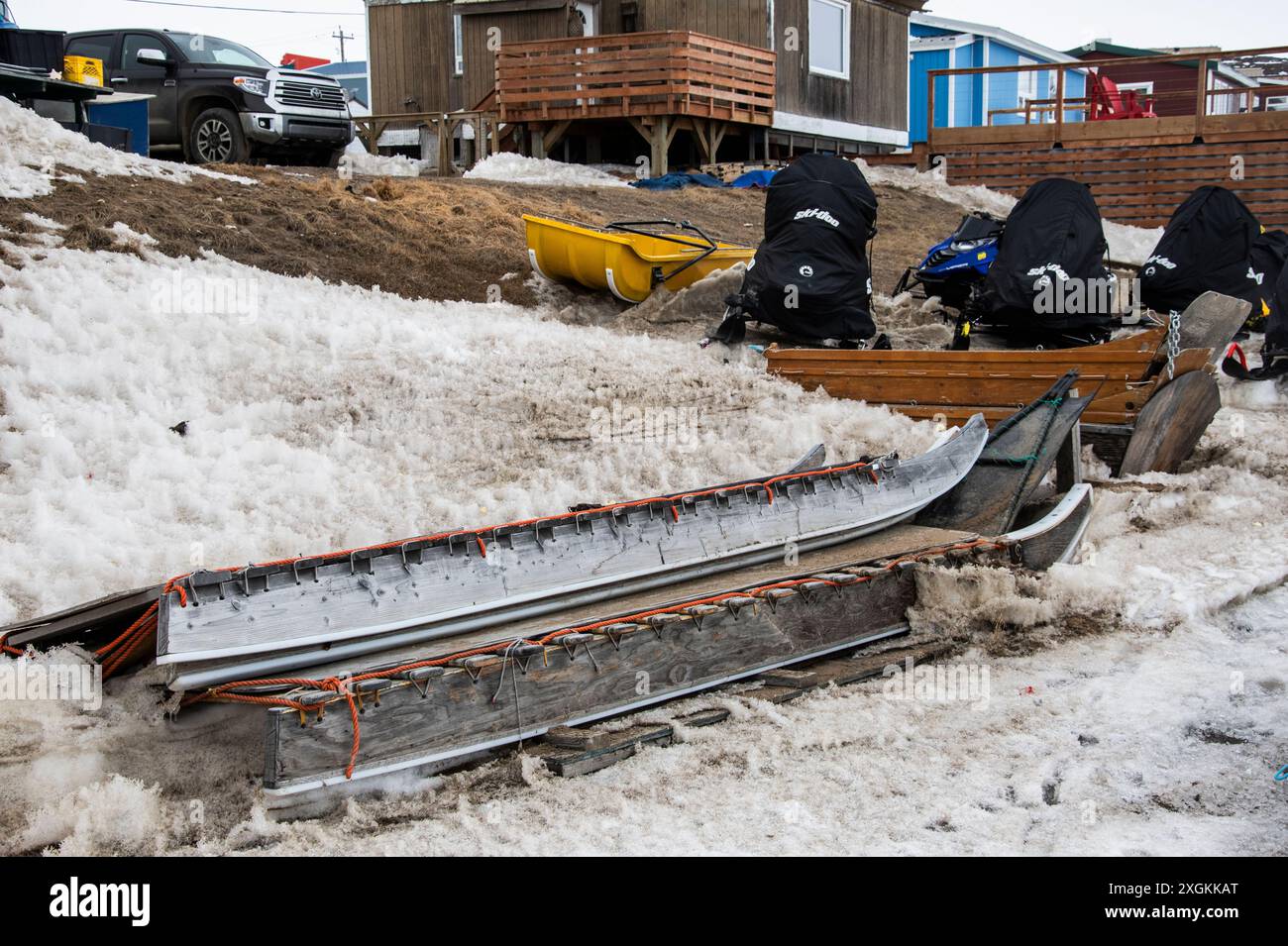 Qamutiik traditional Inuit sleds stored on the beach on Frobisher Bay in Iqaluit, Nunavut ...
