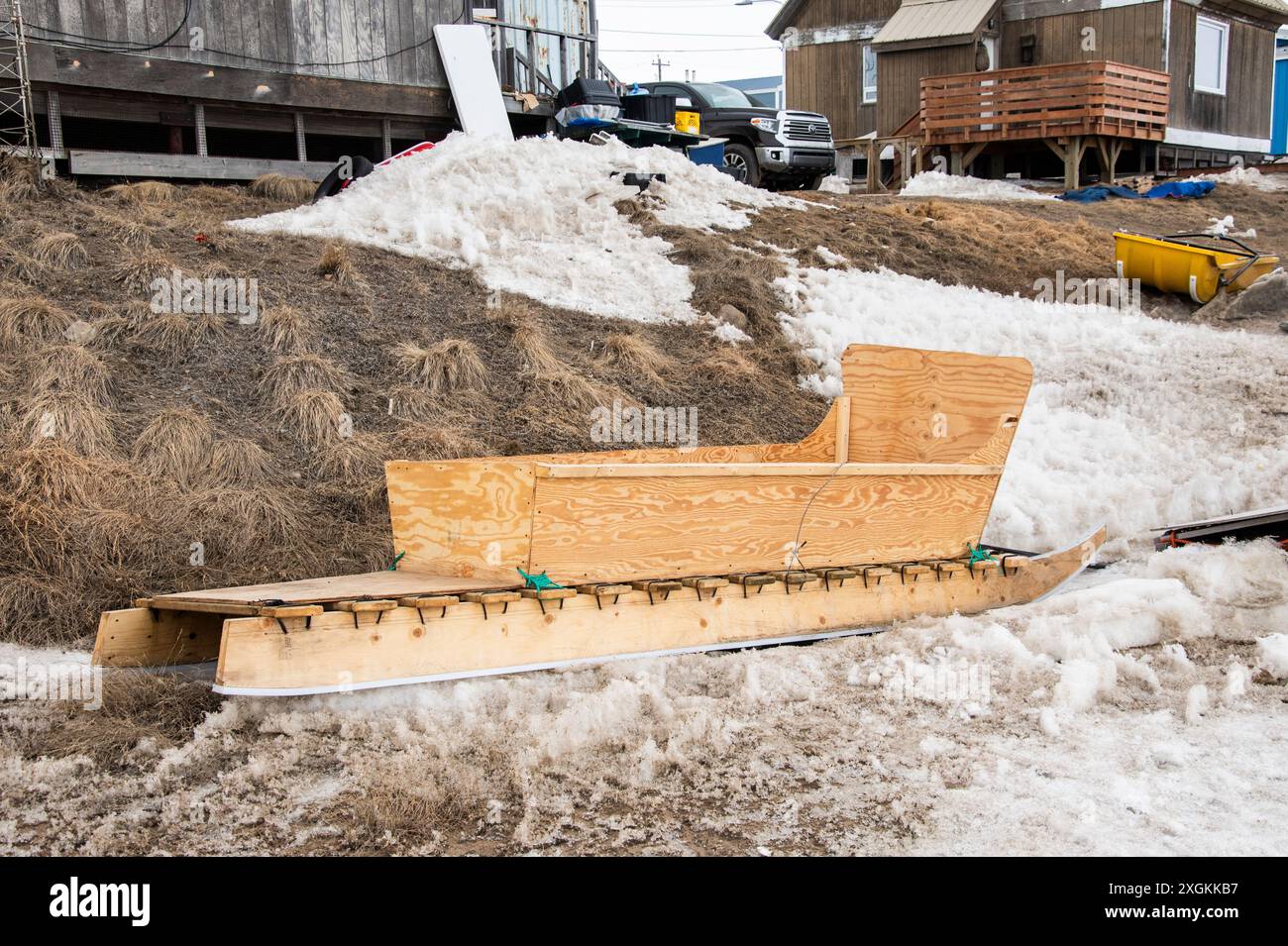 Qamutiik traditional Inuit sleds stored on the beach on Frobisher Bay ...