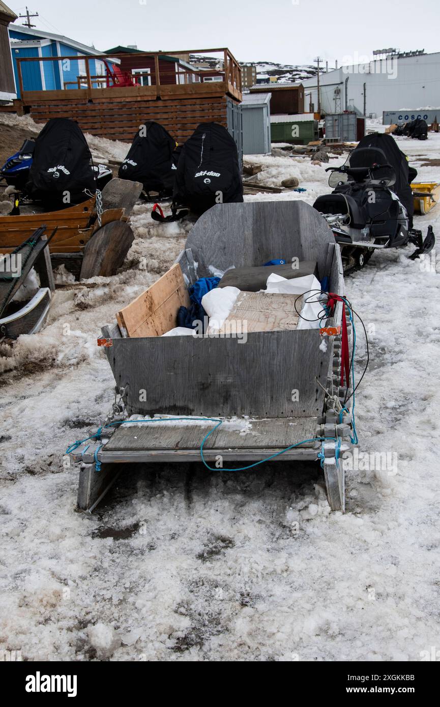 Qamutiik traditional Inuit sleds stored on the beach on Frobisher Bay in Iqaluit, Nunavut ...
