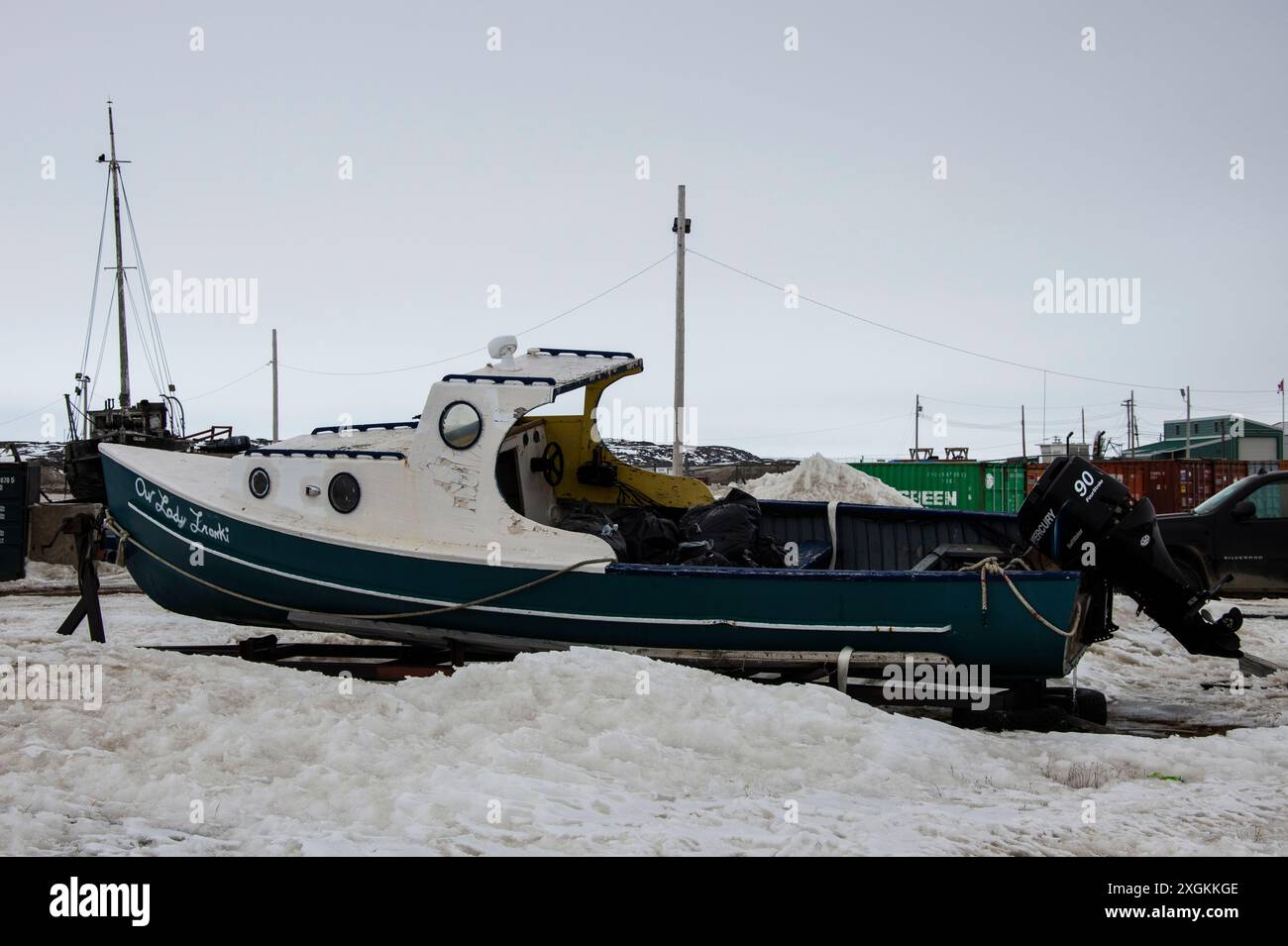 Our Lady Franki boat stored on the beach on Frobisher Bay in Iqaluit, Nunavut, Canada Stock ...