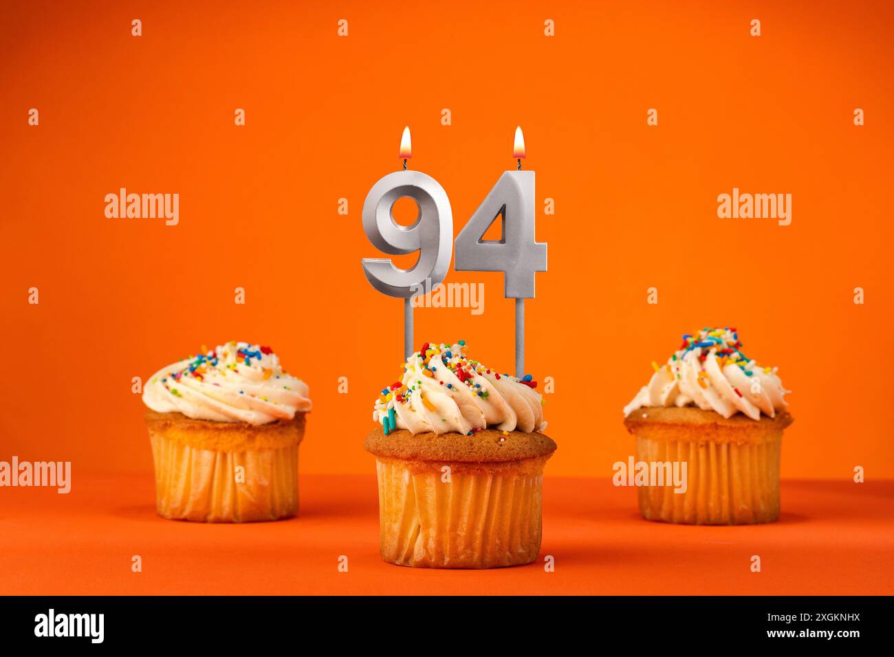 Birthday celebration in orange color - Candle number 94 Stock Photo - Alamy