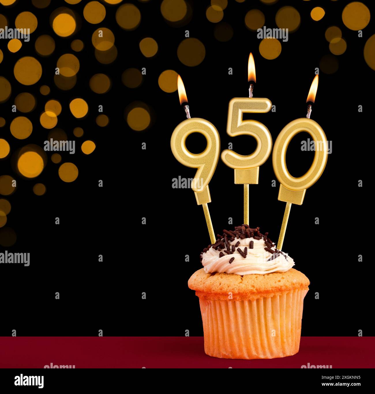 Birthday candle with cupcake - Number 950 on black background with out ...