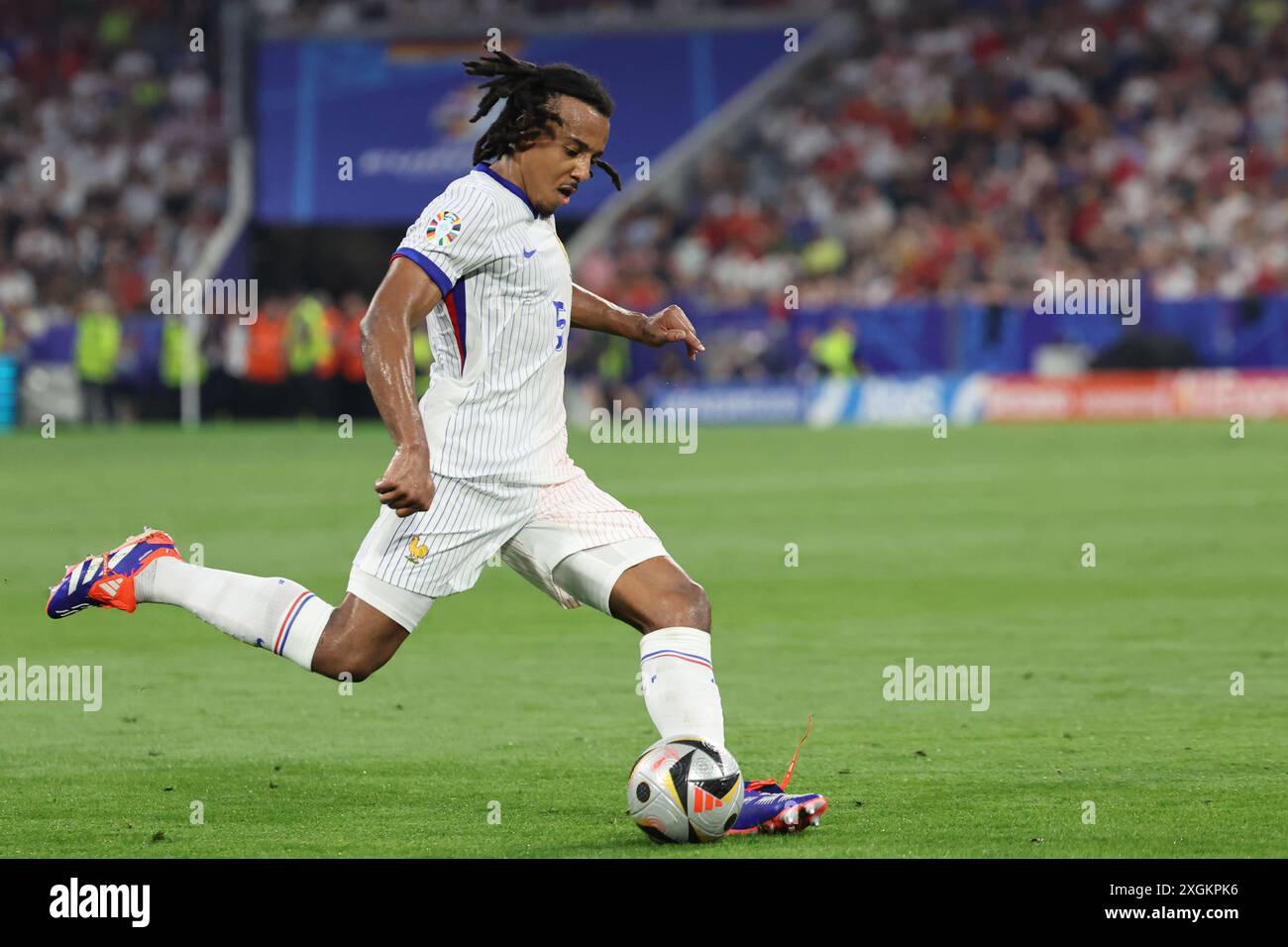 Munich, Germany, 9, July, 2024. Jules Kounde passes the ball during the ...