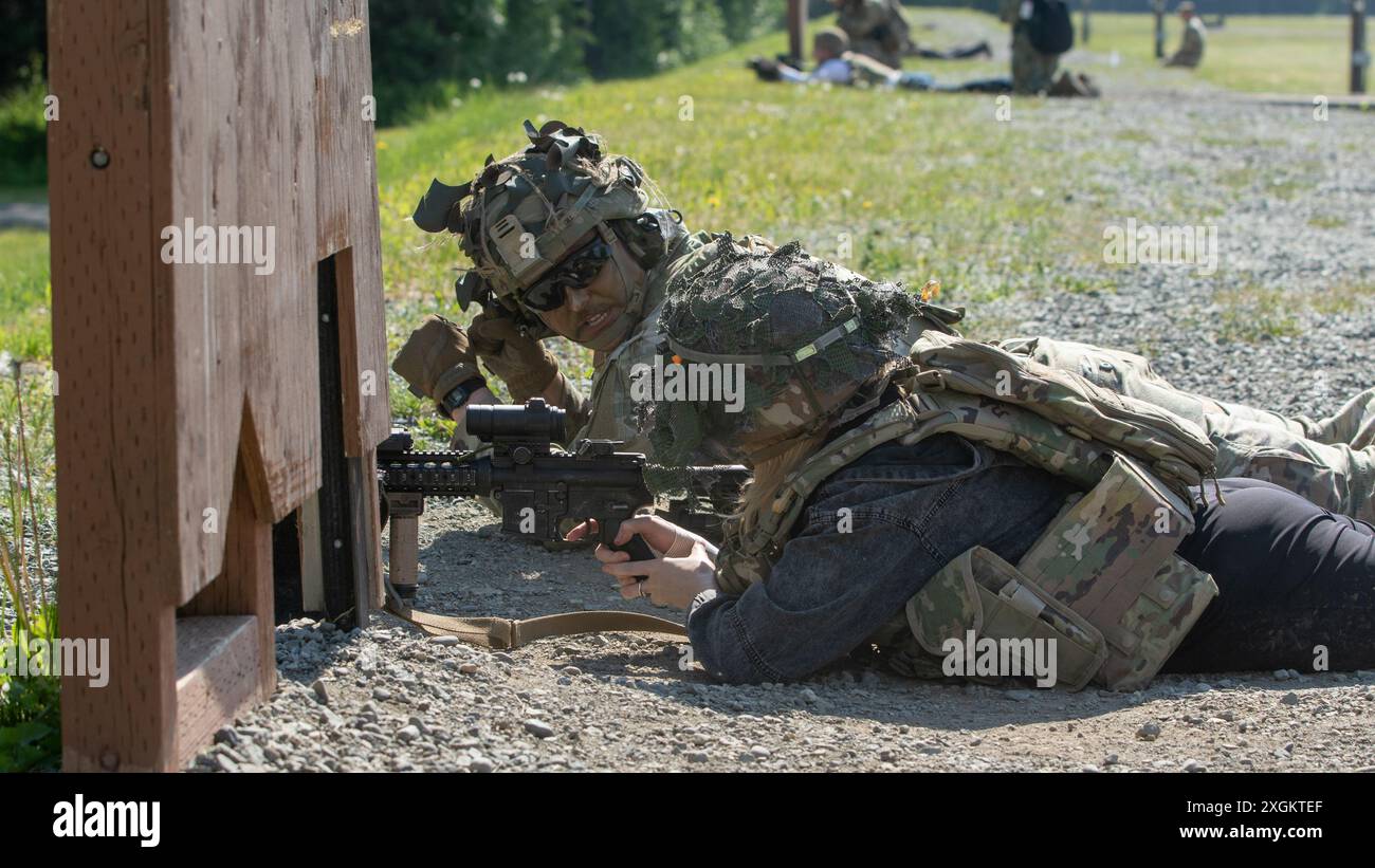 Paratroopers assigned to the 11th Airborne Division assist civilians on ...