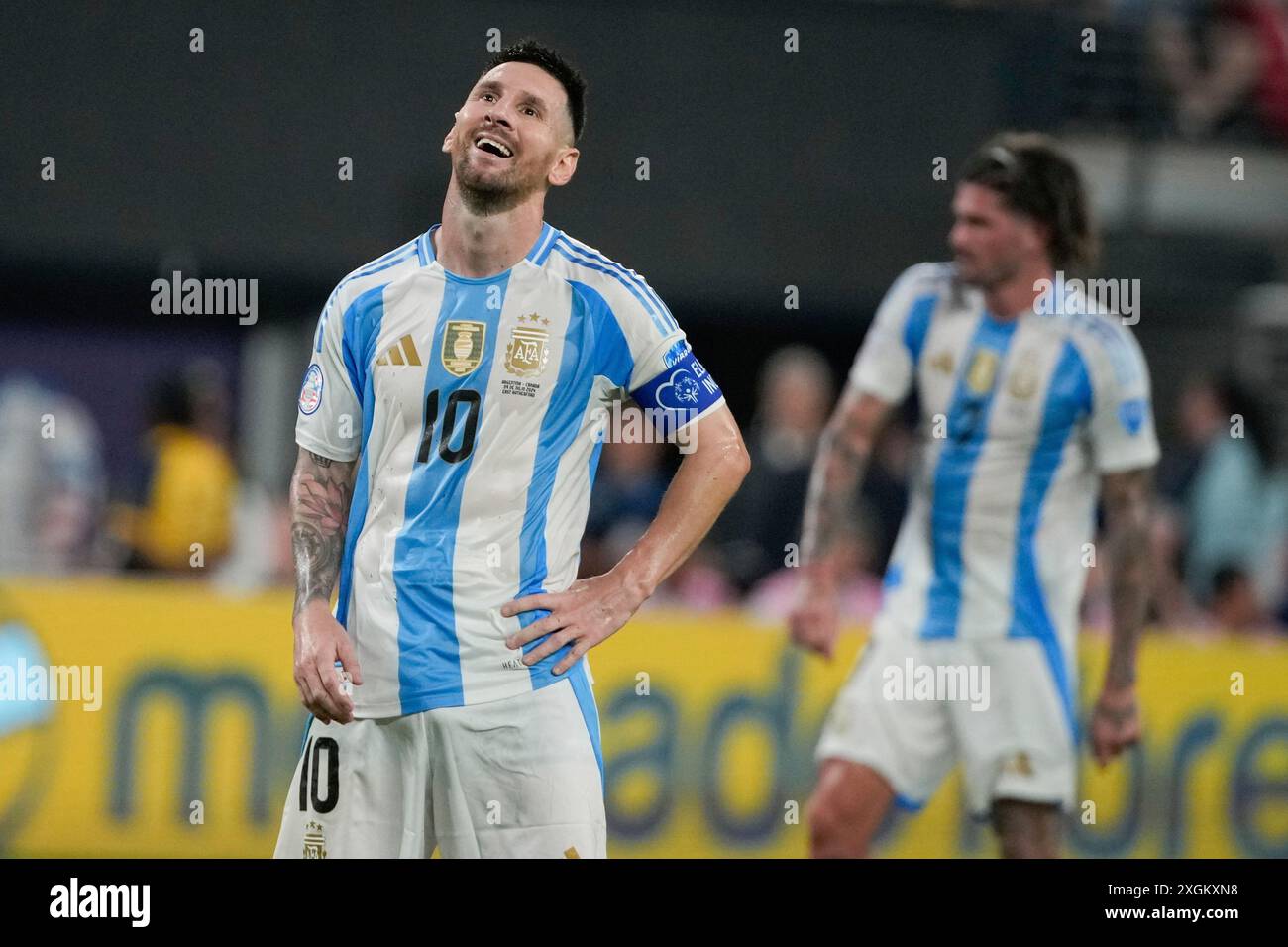 Argentina's Lionel Messi smiles after missing a chance to score against ...