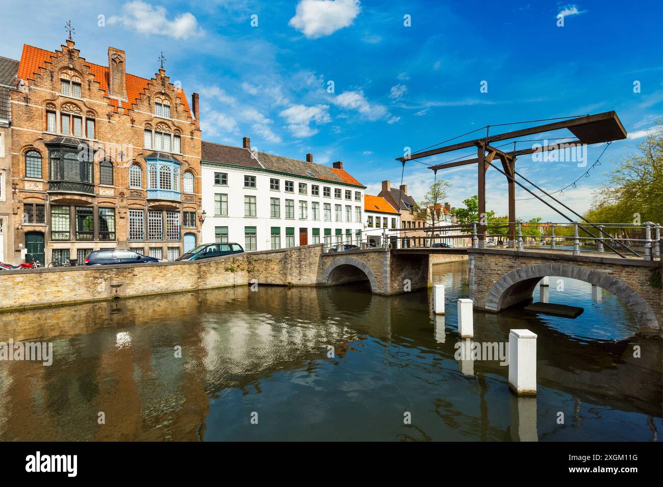 View of Bruges canal and old historic houses of medieval architecture ...