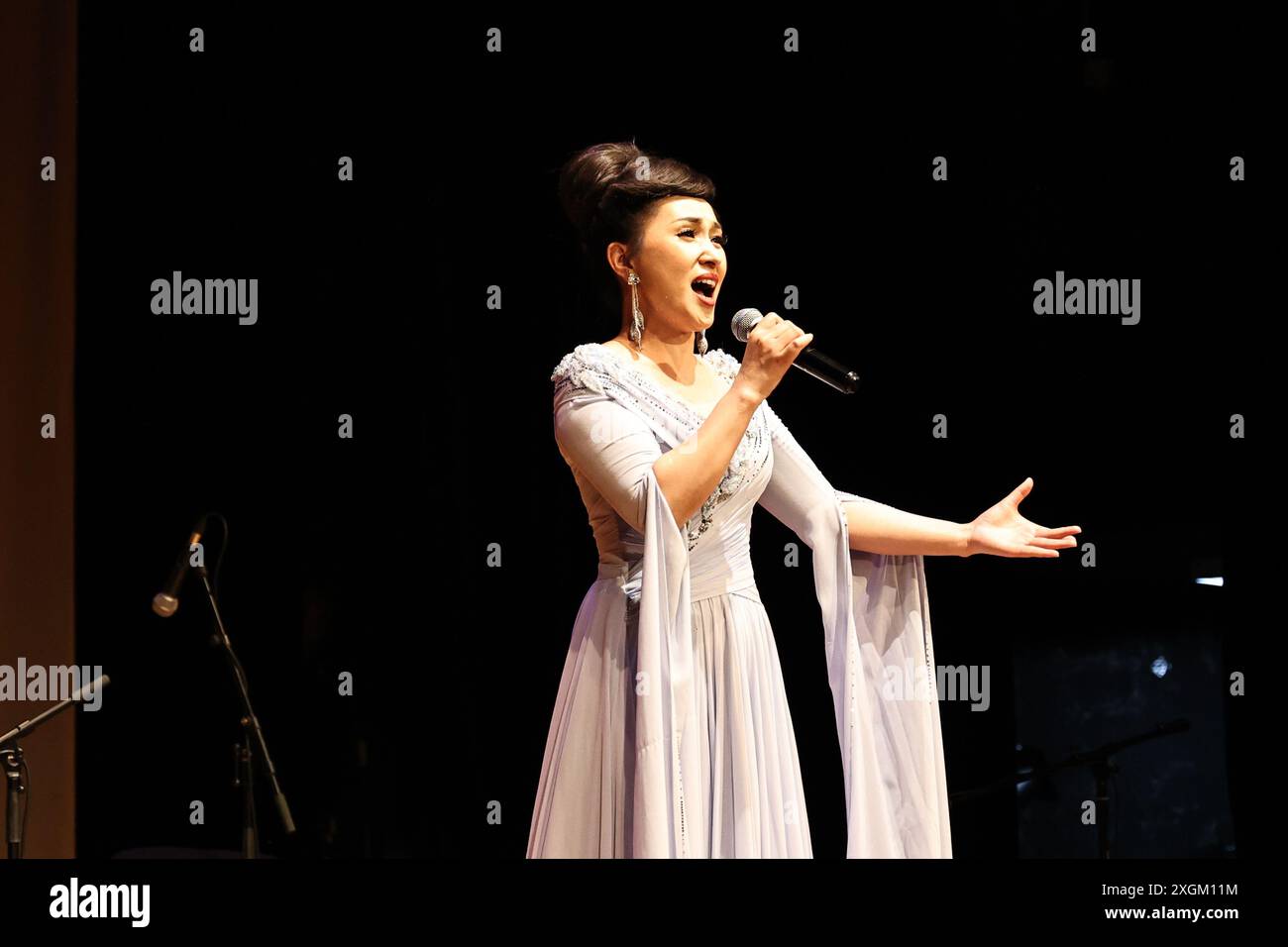 Rabat, Morocco. 8th July, 2024. A Chinese singer performs at a concert ...