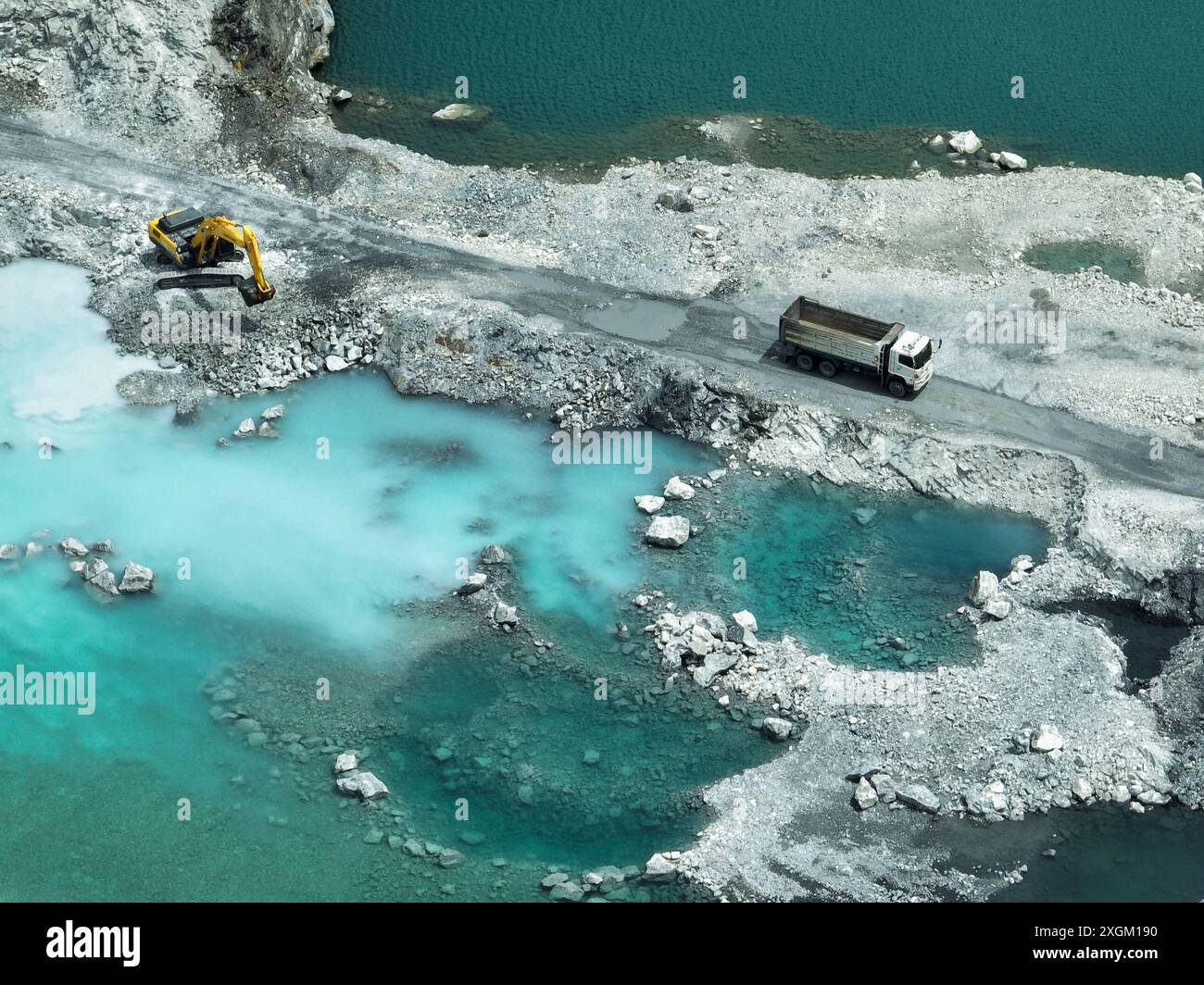 Open pit mine industry. Limestone quarry with backhoe and truck in ...