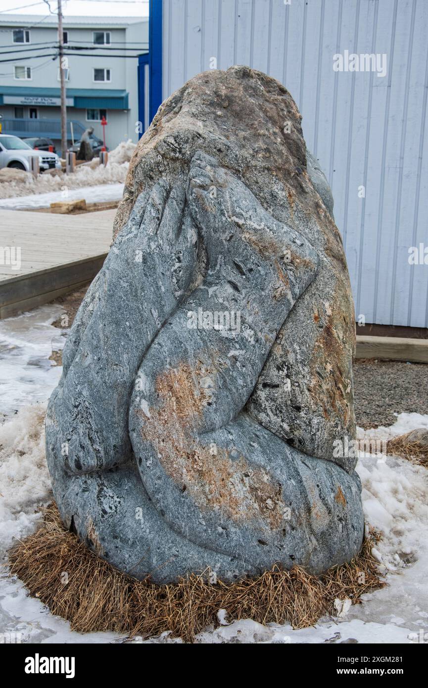 Stone carving of arms and hands at Inuit sculpture park by the Four ...