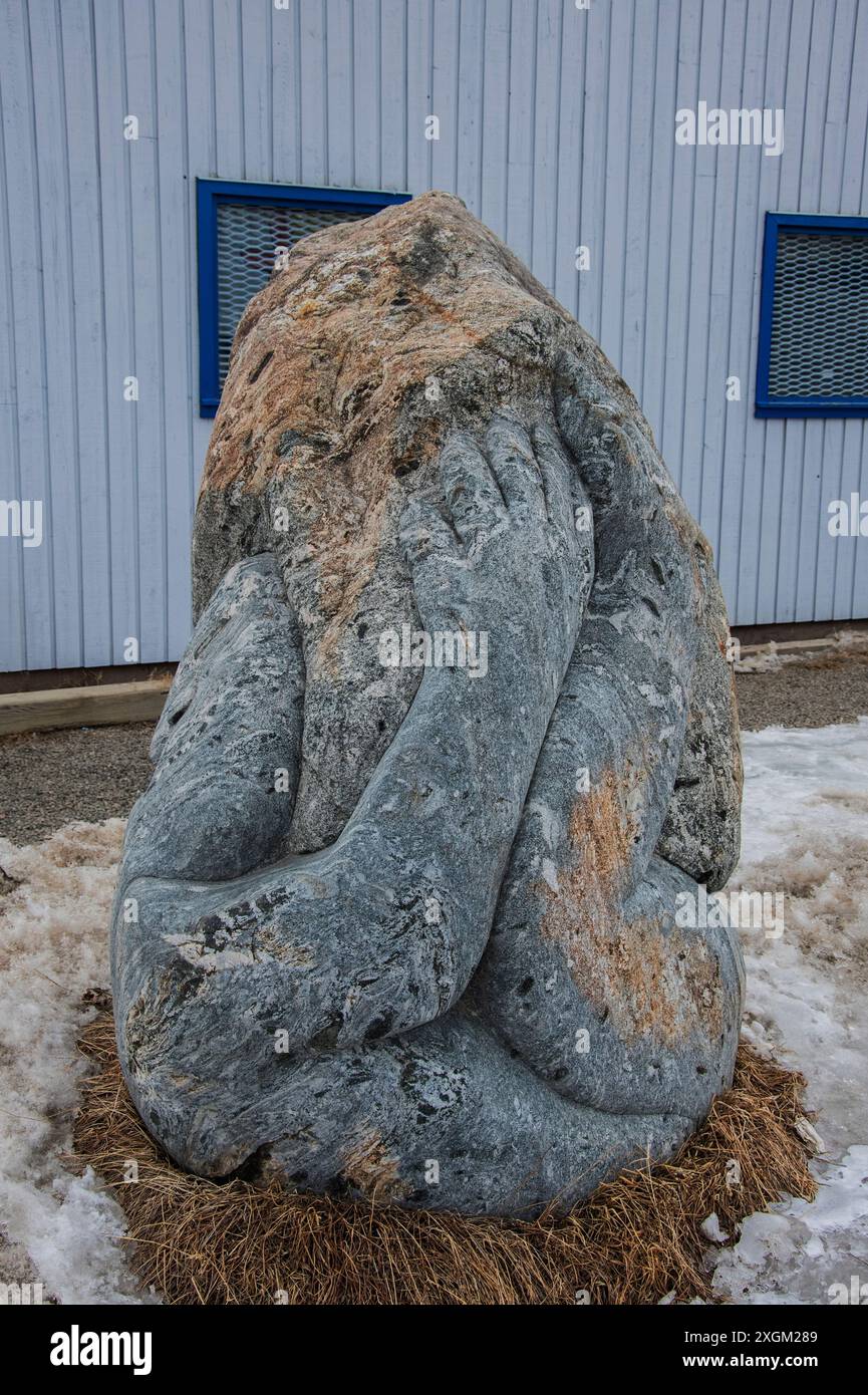 Stone carving of arms and hands at Inuit sculpture park by the Four ...