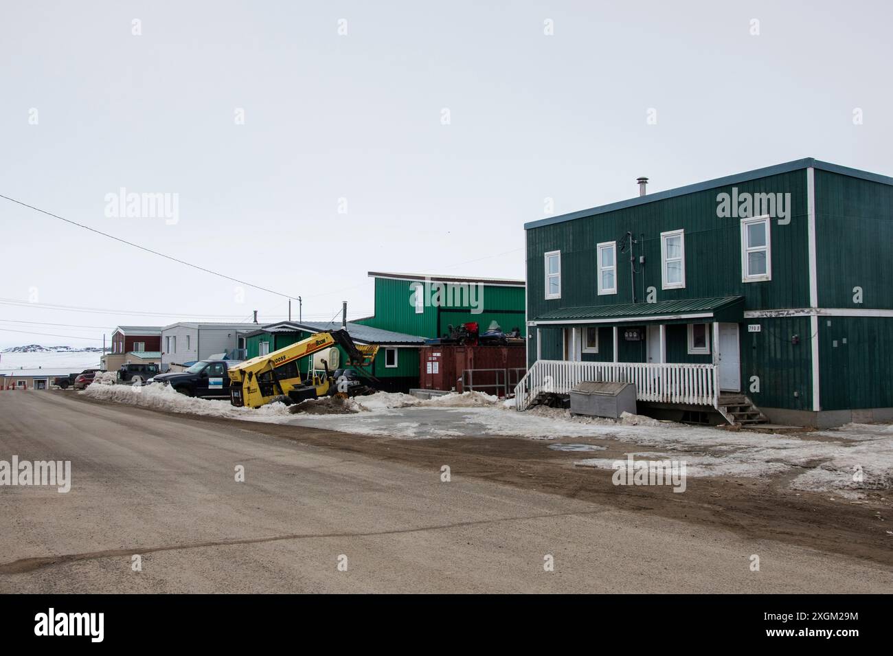 Houses, crane and shipping container on Fred Coman Street in Iqaluit ...