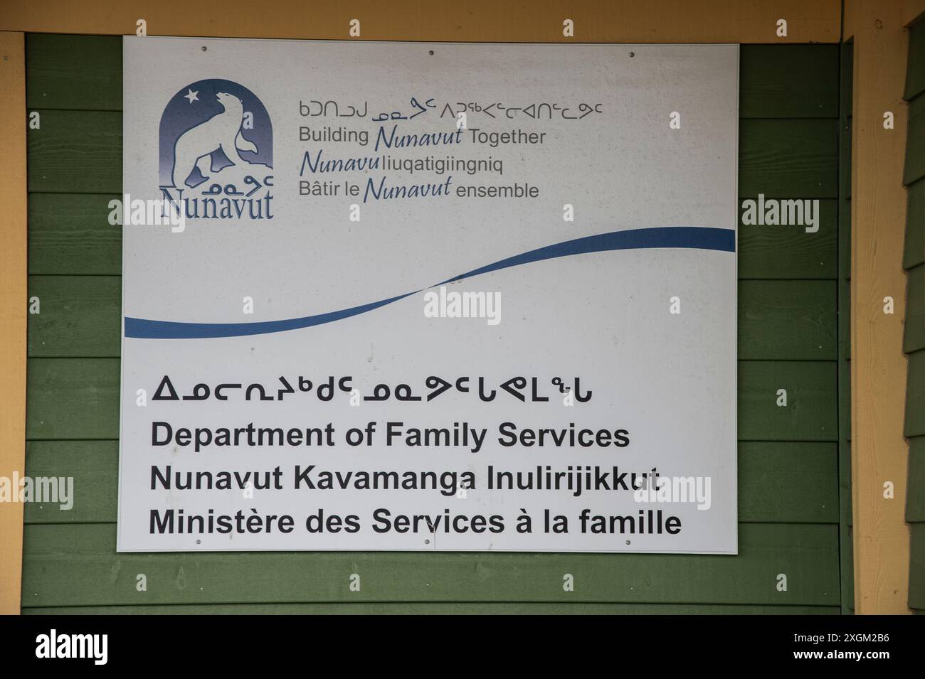 Multilingual Department of Family Services sign in English, French ...