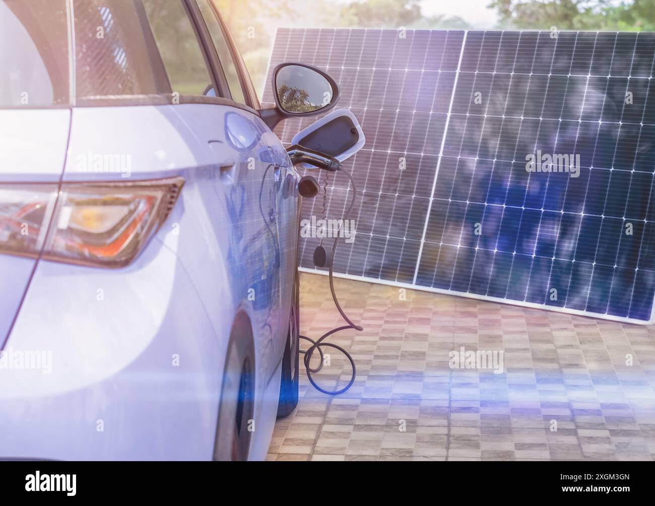 EV charging an electric car from solar panels outdoors Stock Photo - Alamy