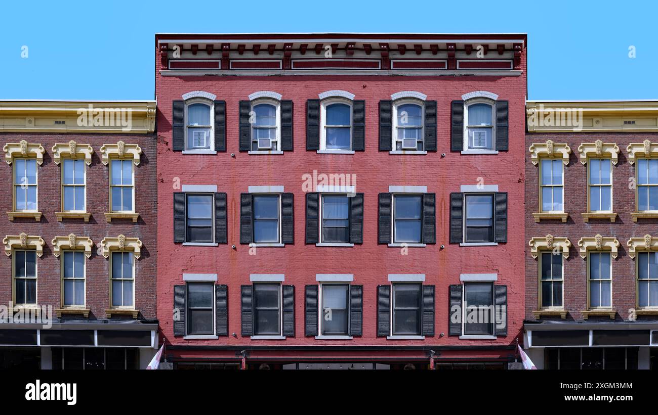 19th century building facades with ornate window frames and roof ...