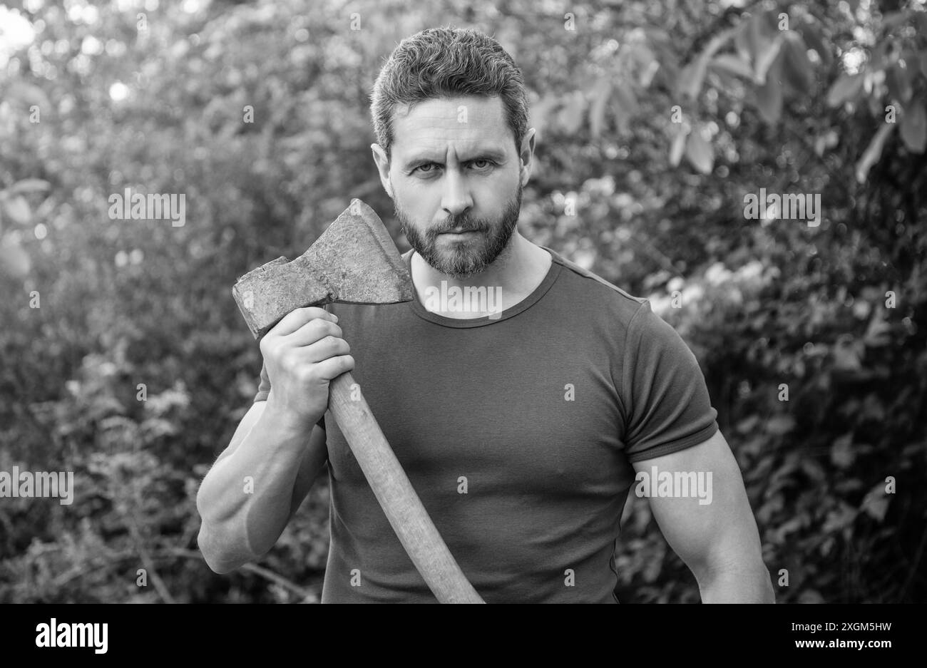 bearded masculine guy hold axe. masculine guy with axe outdoor. photo ...