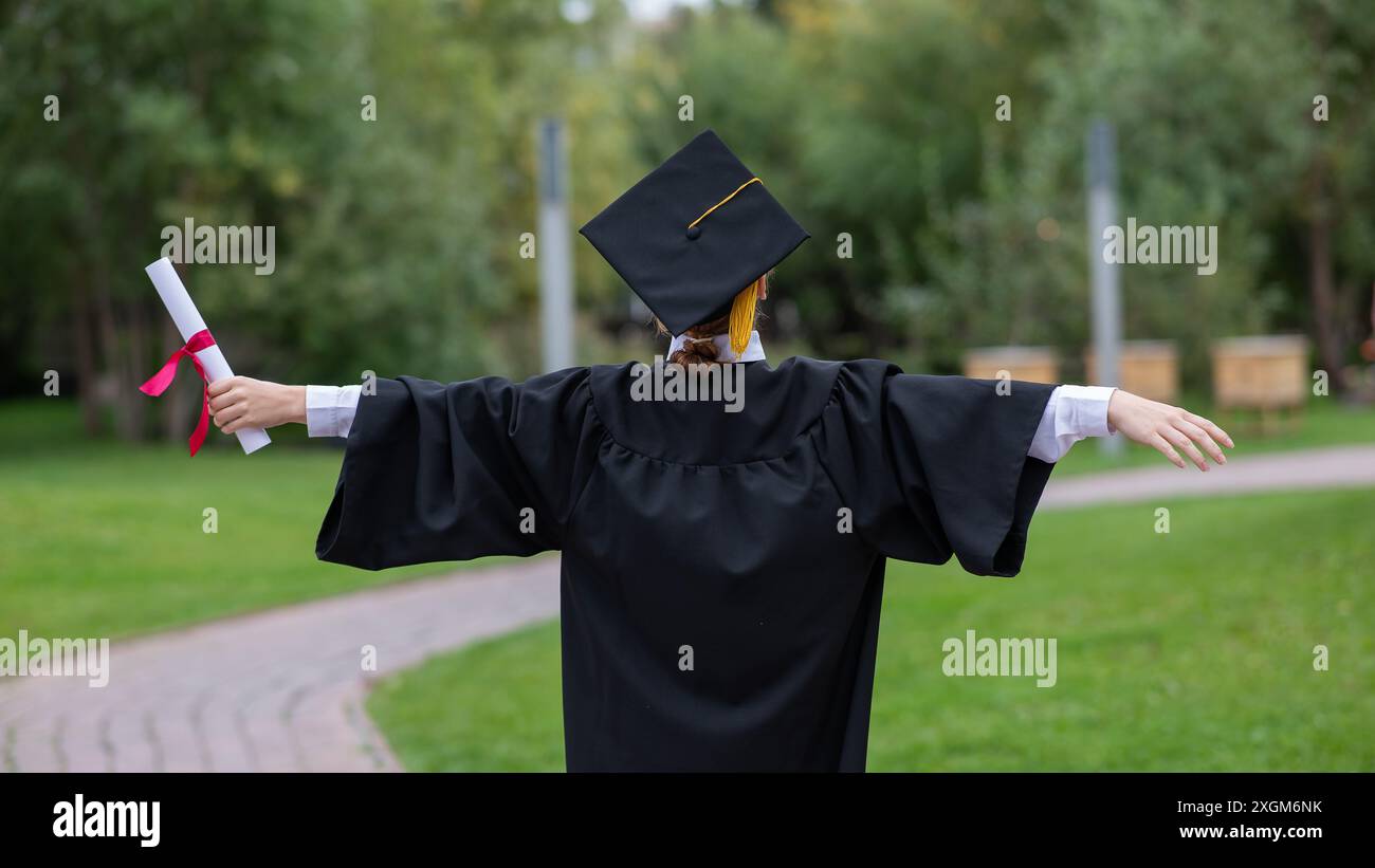 Back view of female student graduate hi-res stock photography and ...