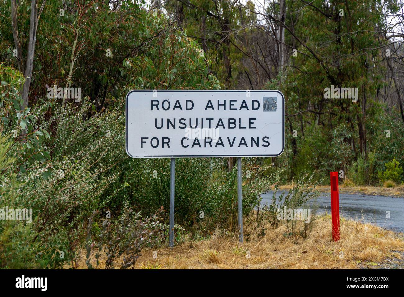 Road sign warning the road ahead is unsuitable for caravans entering ...