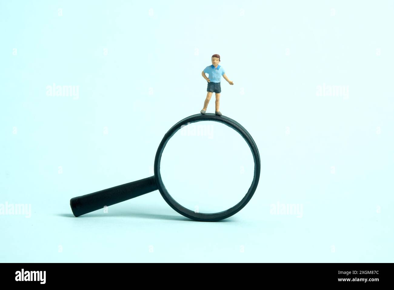 Miniature people toy figure photography. Children curiosity concept. A ...
