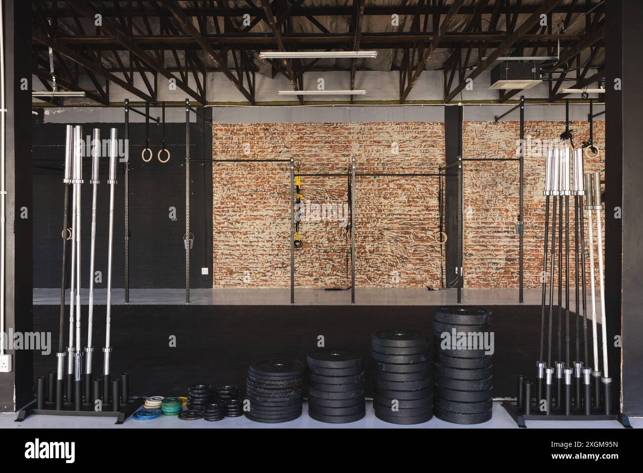 A well-equipped gym with various workout equipment, with copy space ...