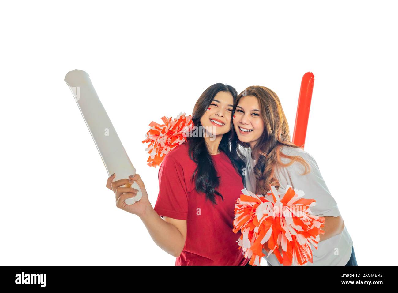 Portrait of two Indonesian women with an excited expression supporting ...