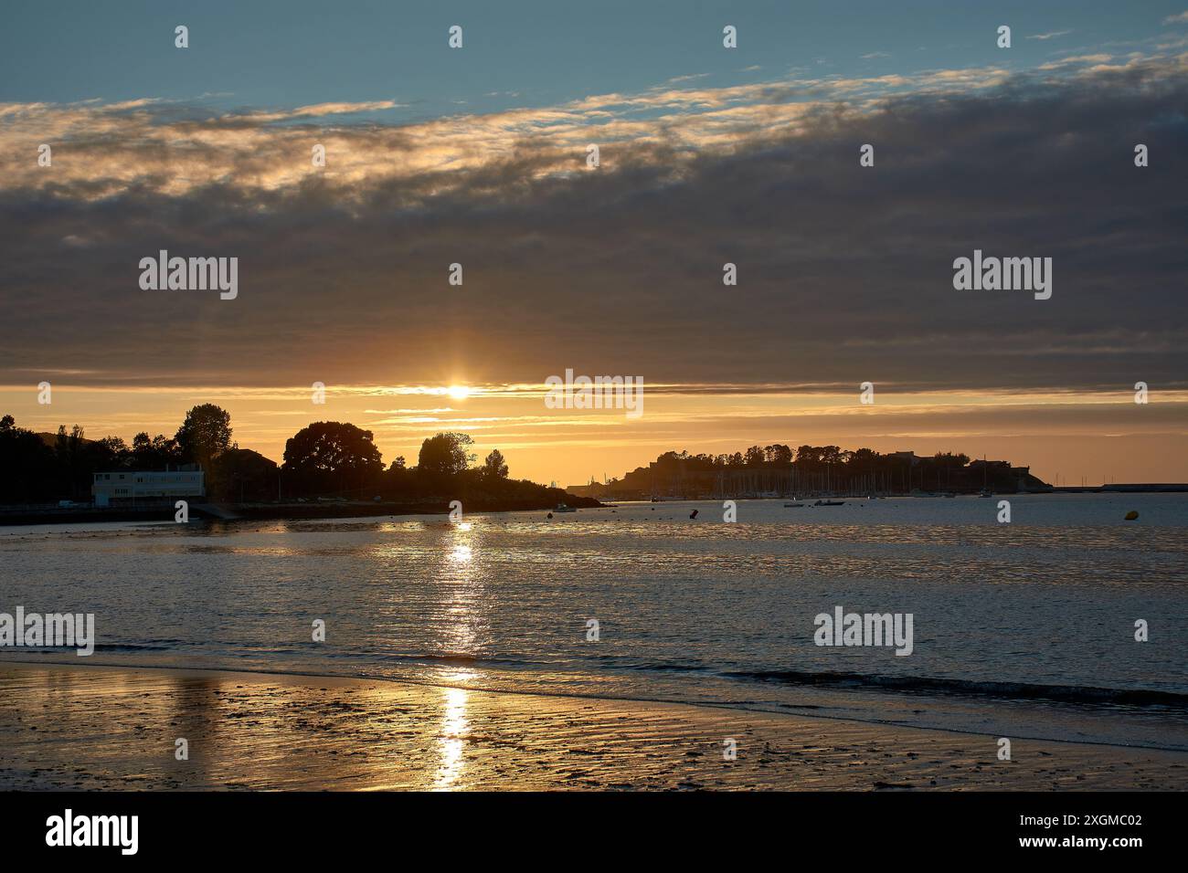 Serene beauty of a sunset at Ladeira Beach in Sabaris. Soft clouds ...