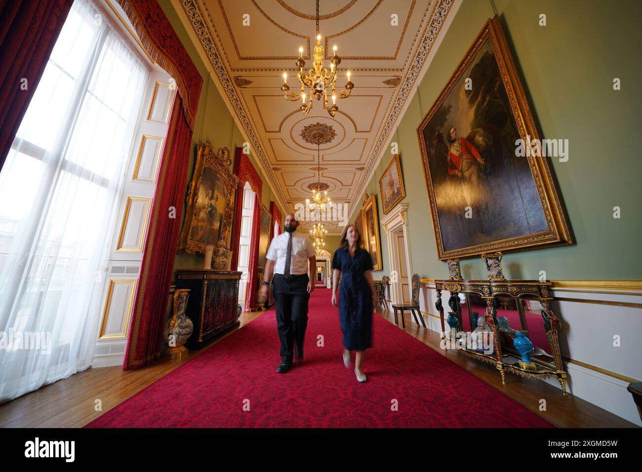 Members of Royal Collection Trust staff walk through the Principal ...