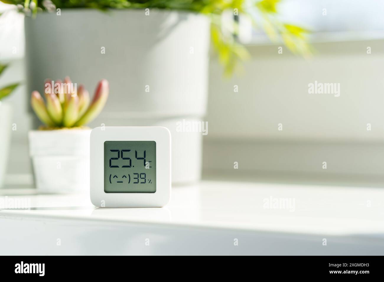 White Digital Thermometer Displaying Room Temperature and Humidity ...