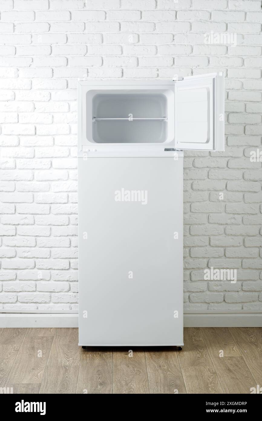 White Refrigerator In A Modern Kitchen With Brick Wall Stock Photo - Alamy