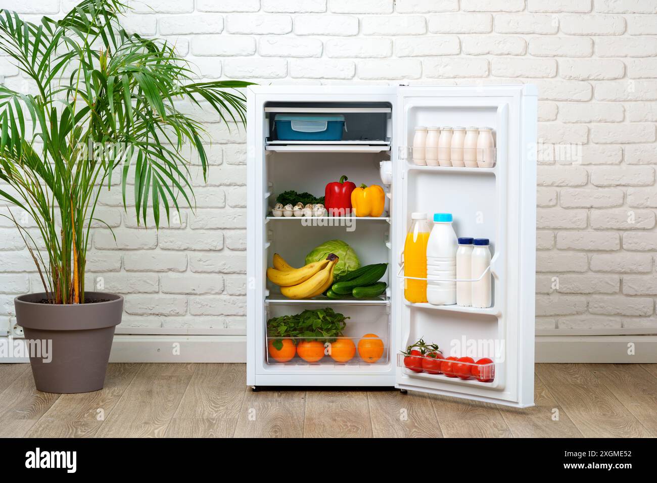 Open White Refrigerator With Fresh Produce In A Kitchen Stock Photo - Alamy