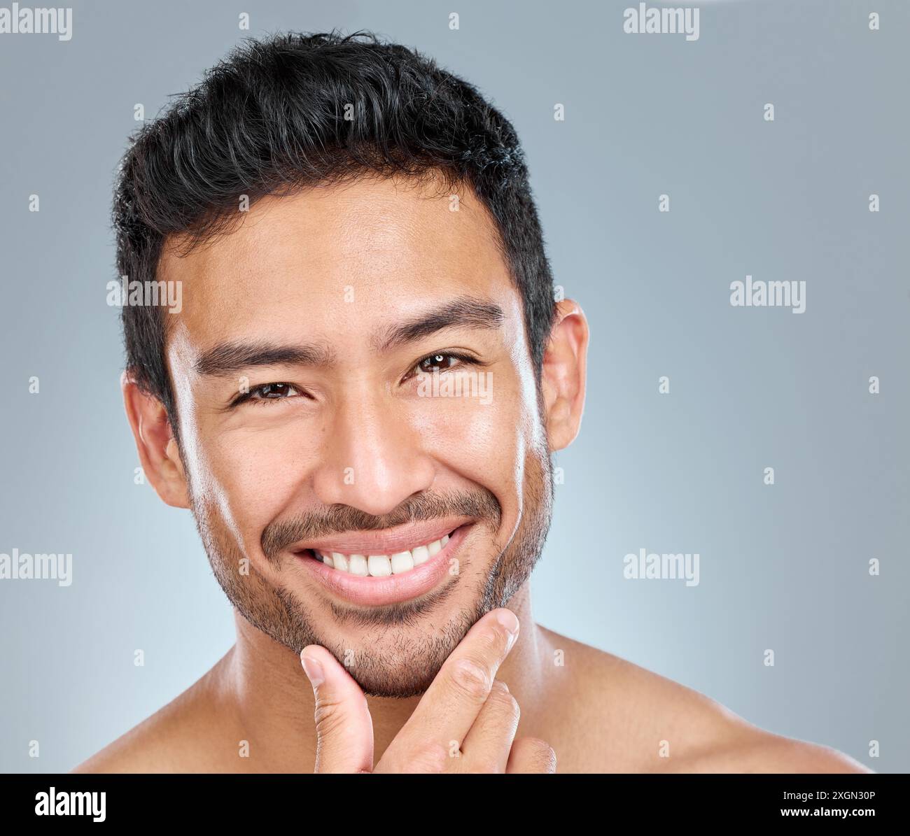 Grooming, portrait and skincare with masculine man in studio on gray ...