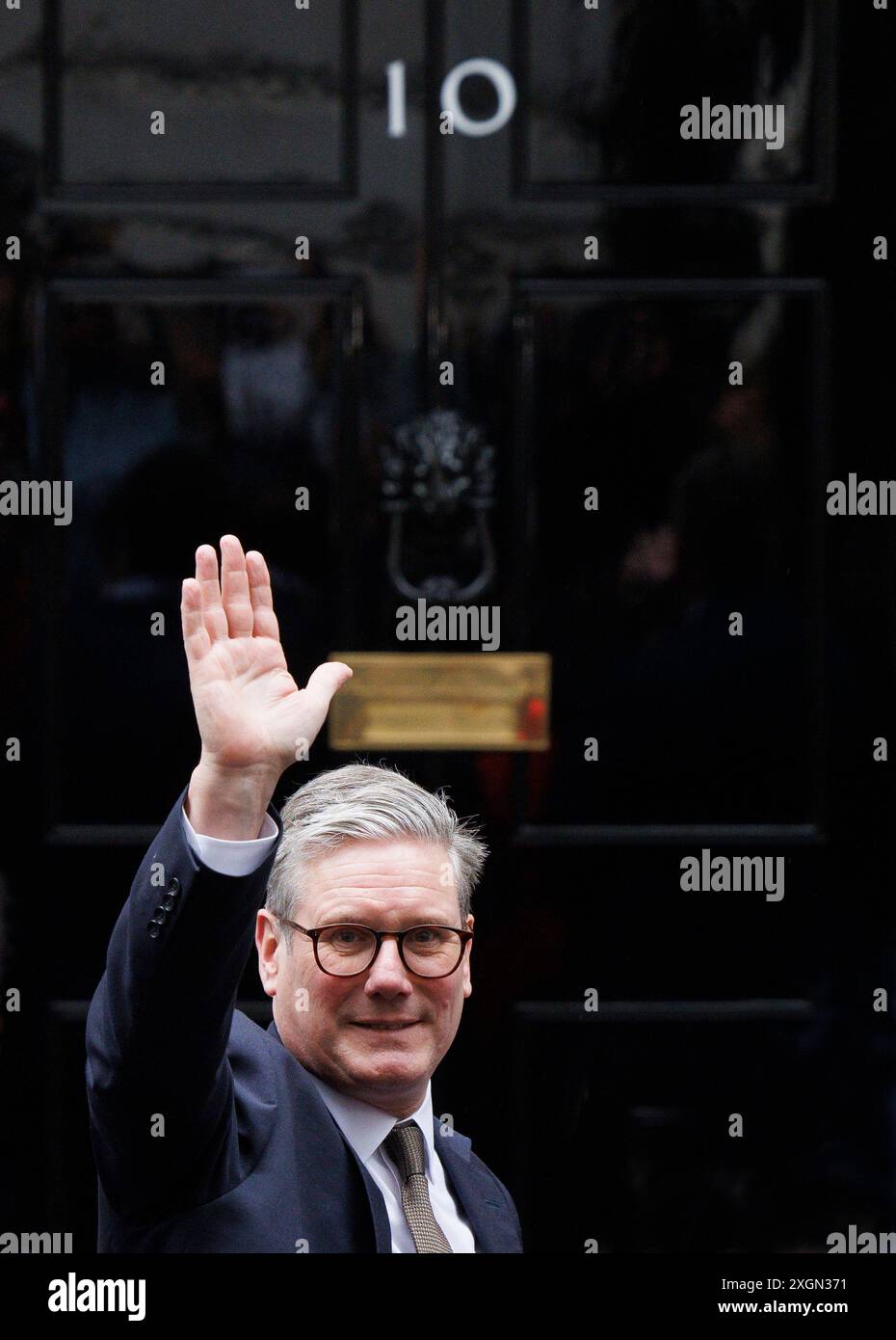 British Prime Minister, Keir Starmer, waves at the door of Number 10 ...