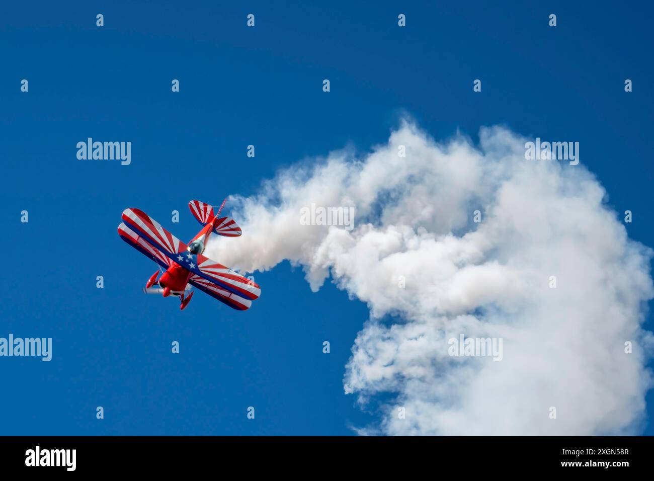 Aerobatic pilot at an air show with his biplane Stock Photo - Alamy