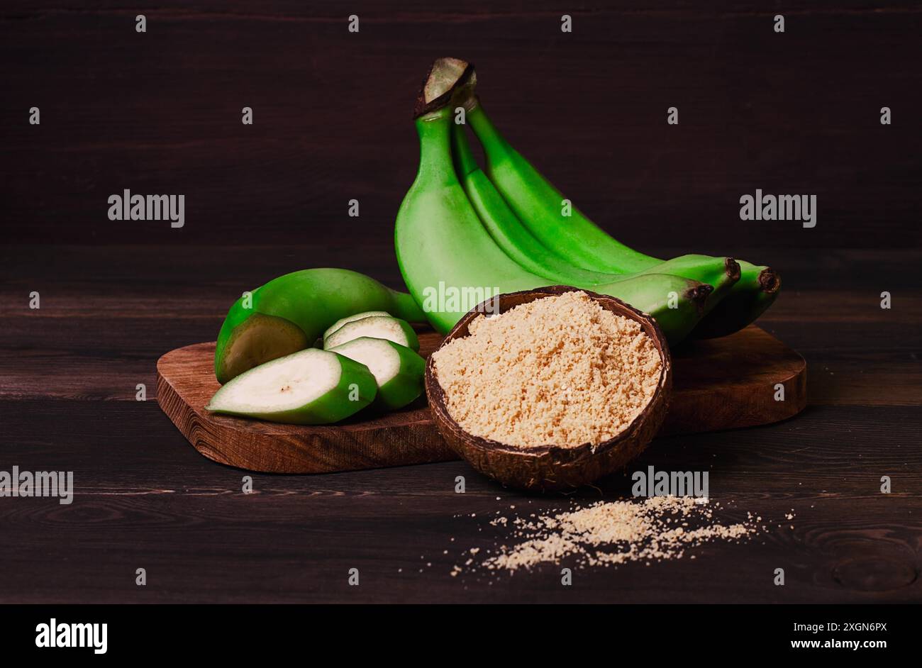 Green banana flour, on a wooden table, healthy food, selective focus ...