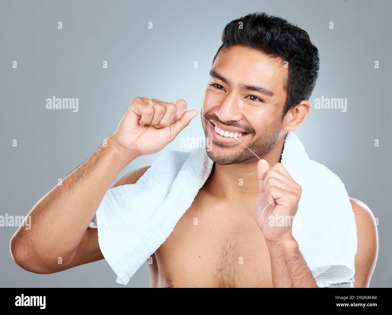 Happy man, teeth and floss in studio for hygiene, cleaning and grooming for daily routine. Male ...