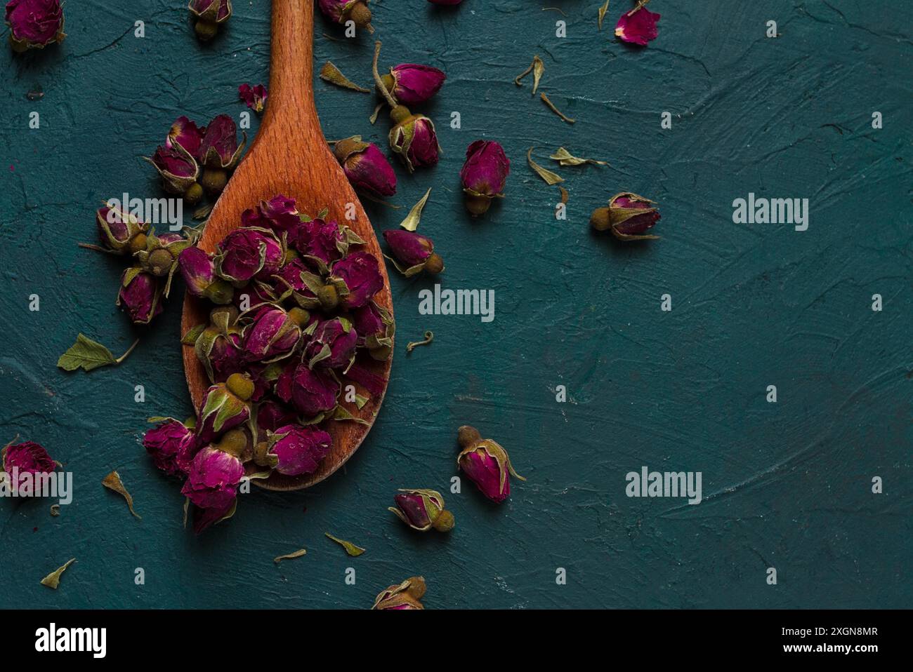 Pink Tea, Damask rose buds, wooden spoon, top view, no people Stock ...
