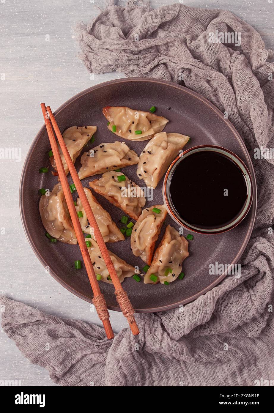 Japanese Gyoza dumplings, fried, with sauce, top view, without people ...