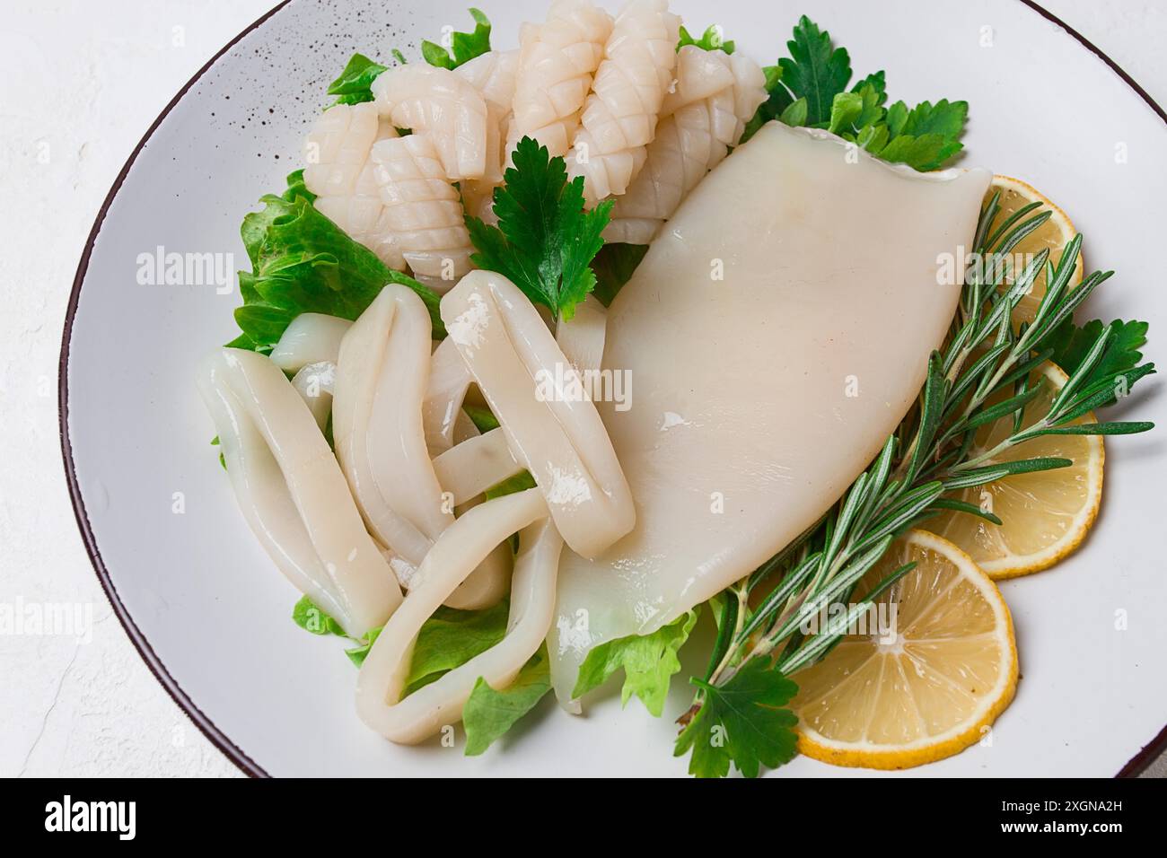 Fresh squid, raw, carcass, cut into rings, top view, no people Stock ...