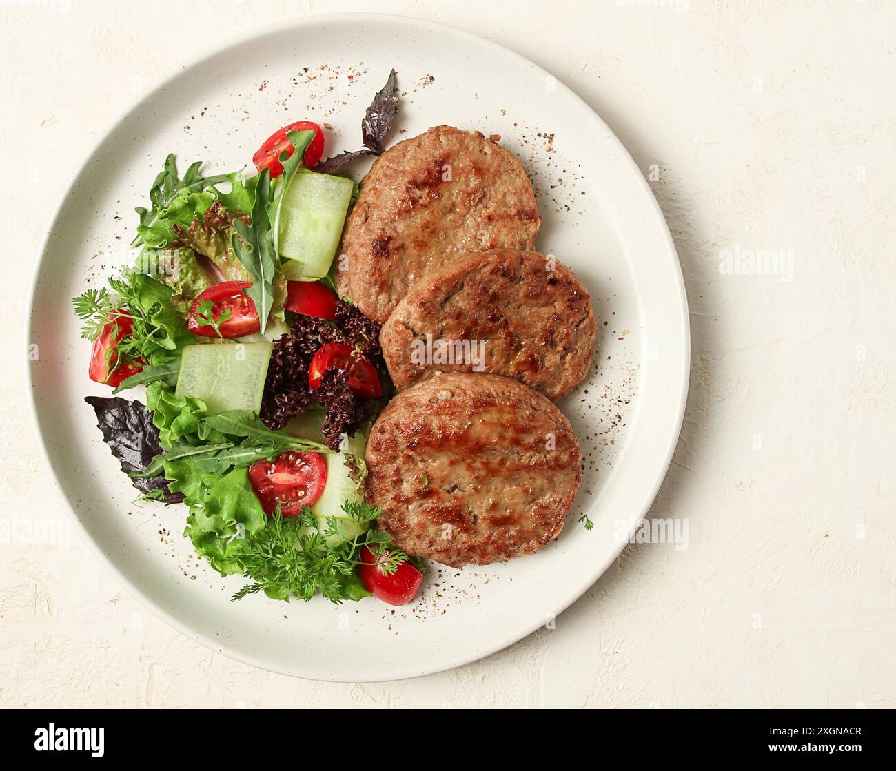 Fried cutlets, minced beef, with vegetable salad, top view, no people ...