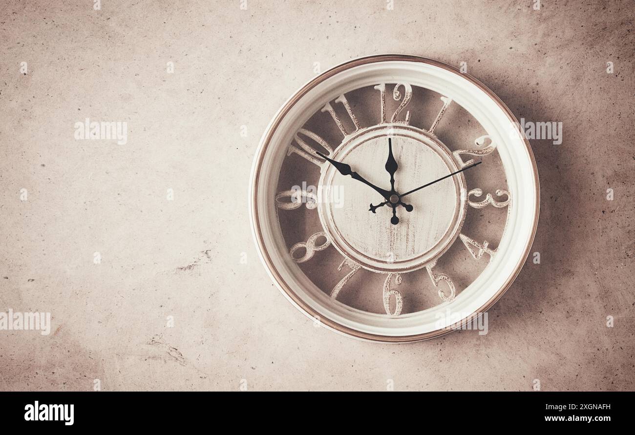 Mechanical wall clock, transparent, beige color, on a light painted ...