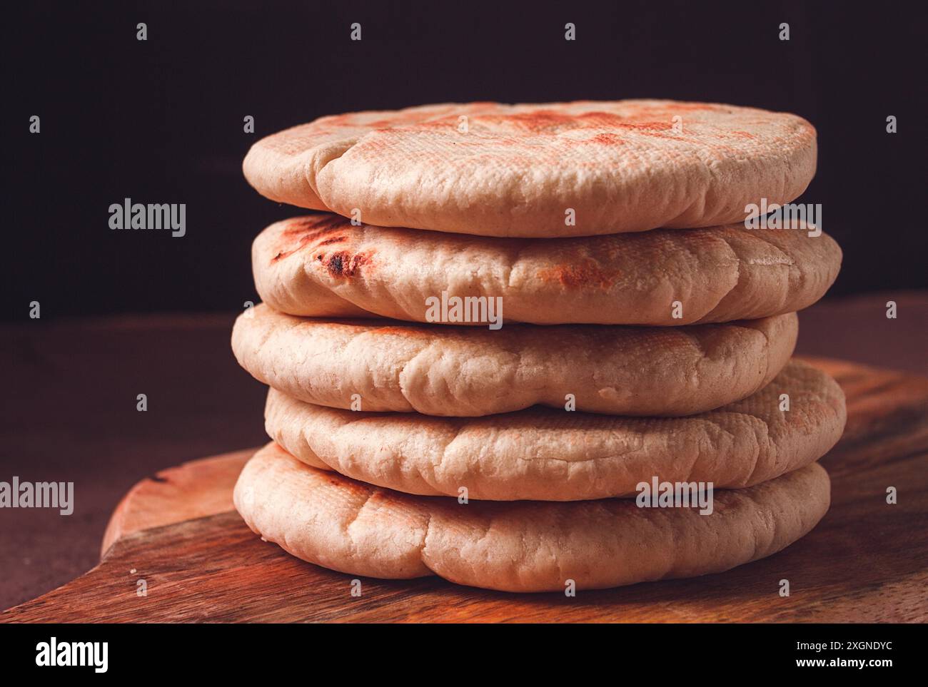 Pita bread, stack, on the table, no people Stock Photo - Alamy