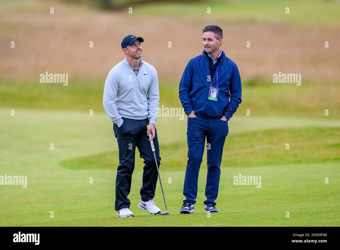 Rory McIlroy speaks with his manager, Sean O'Flaherty, during The ...