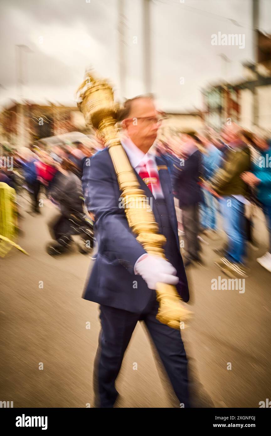 Man carrying the ceremonial mace after outdoor service in Blackpool ...