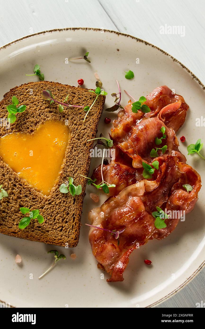 Breakfast, fried egg with bacon, micro-green, on a light background, no ...