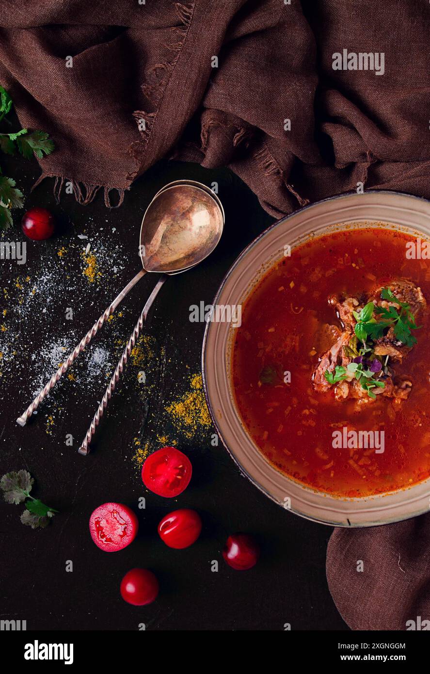 Traditional Georgian dish spicy tomato, Kharcho soup, on a dark ...