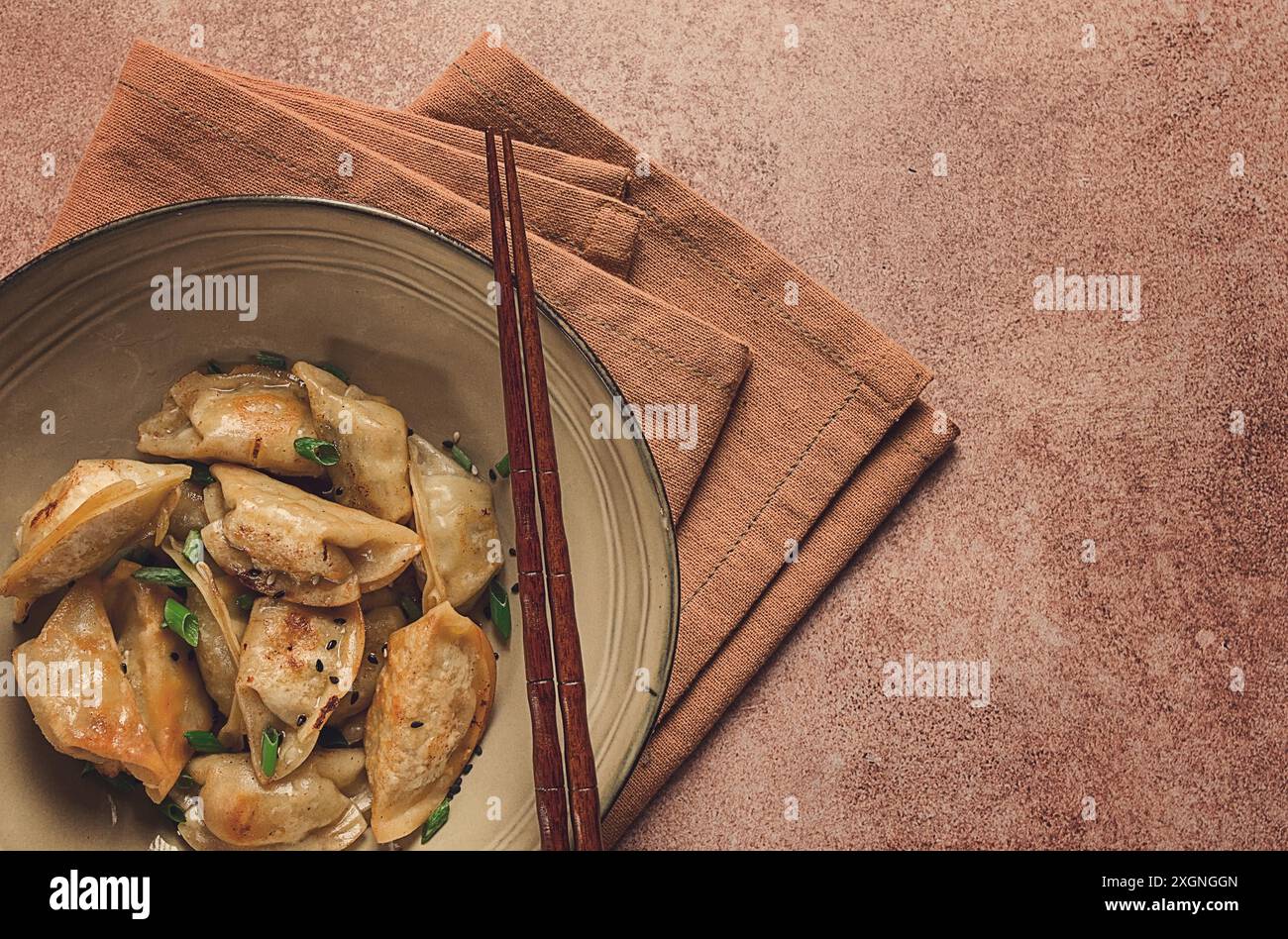 Japanese fried gyoza dumplings, with pork, sesame seeds, green onions ...